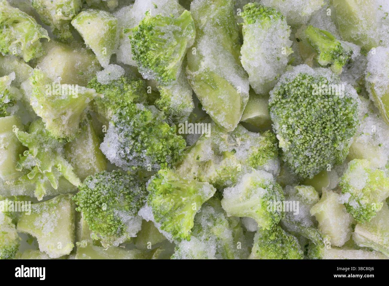 Frozen diced green broccoli background with ice and frost Stock Photo ...