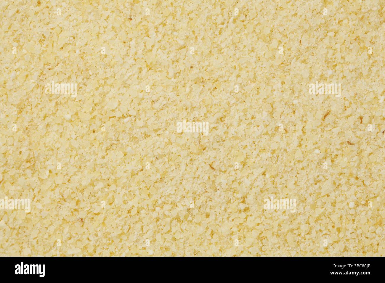 Background of yellow semolina wheat flour at life-size magnification ...