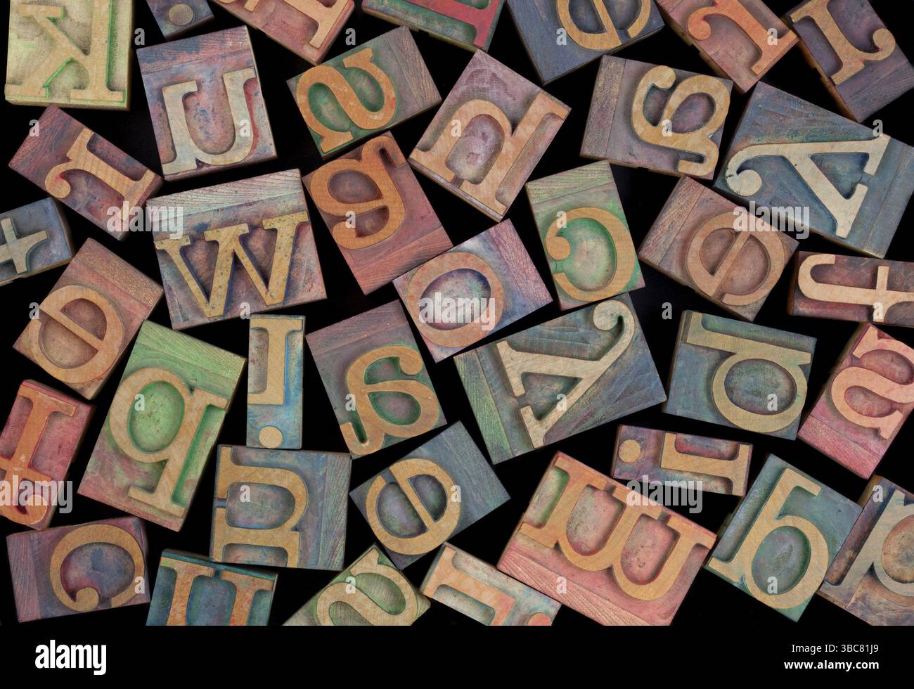Letters of alphabet in vintage wood letterpress printing blocks, placed ...