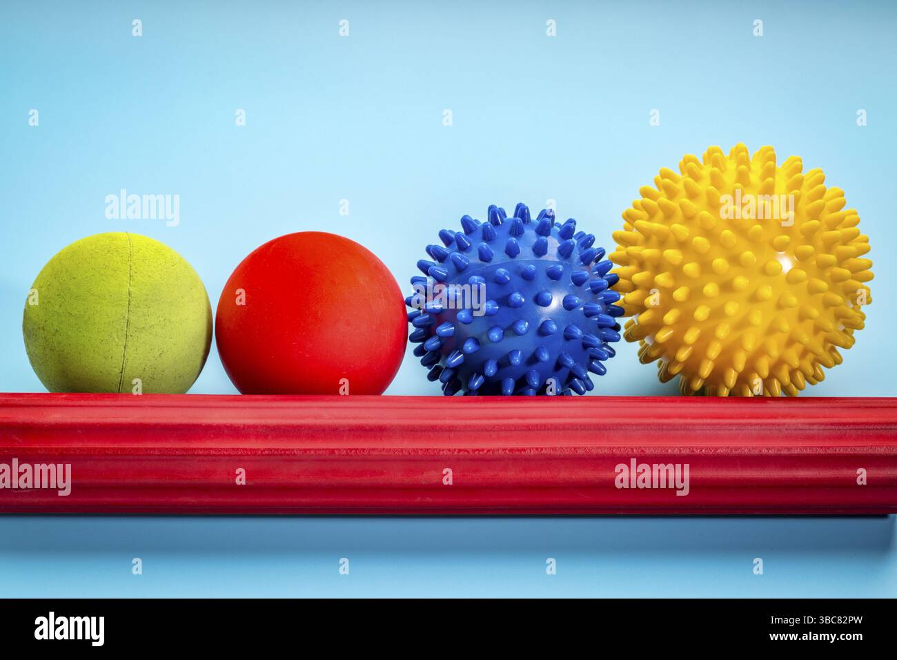 Self massage and reflexology therapy concept - a set of small rubber ...