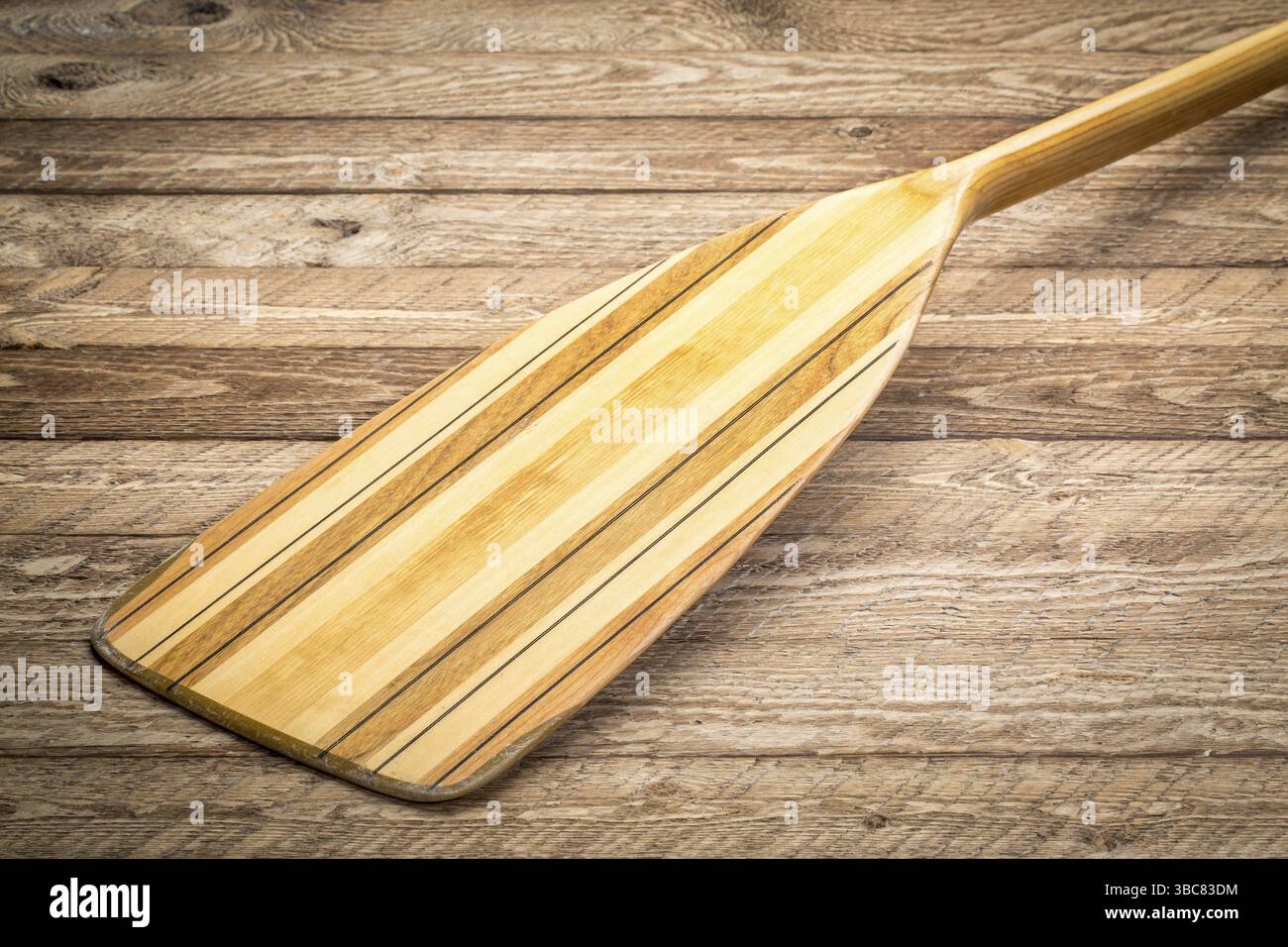 Blade of wooden canoe paddle against weathered wood background Stock ...