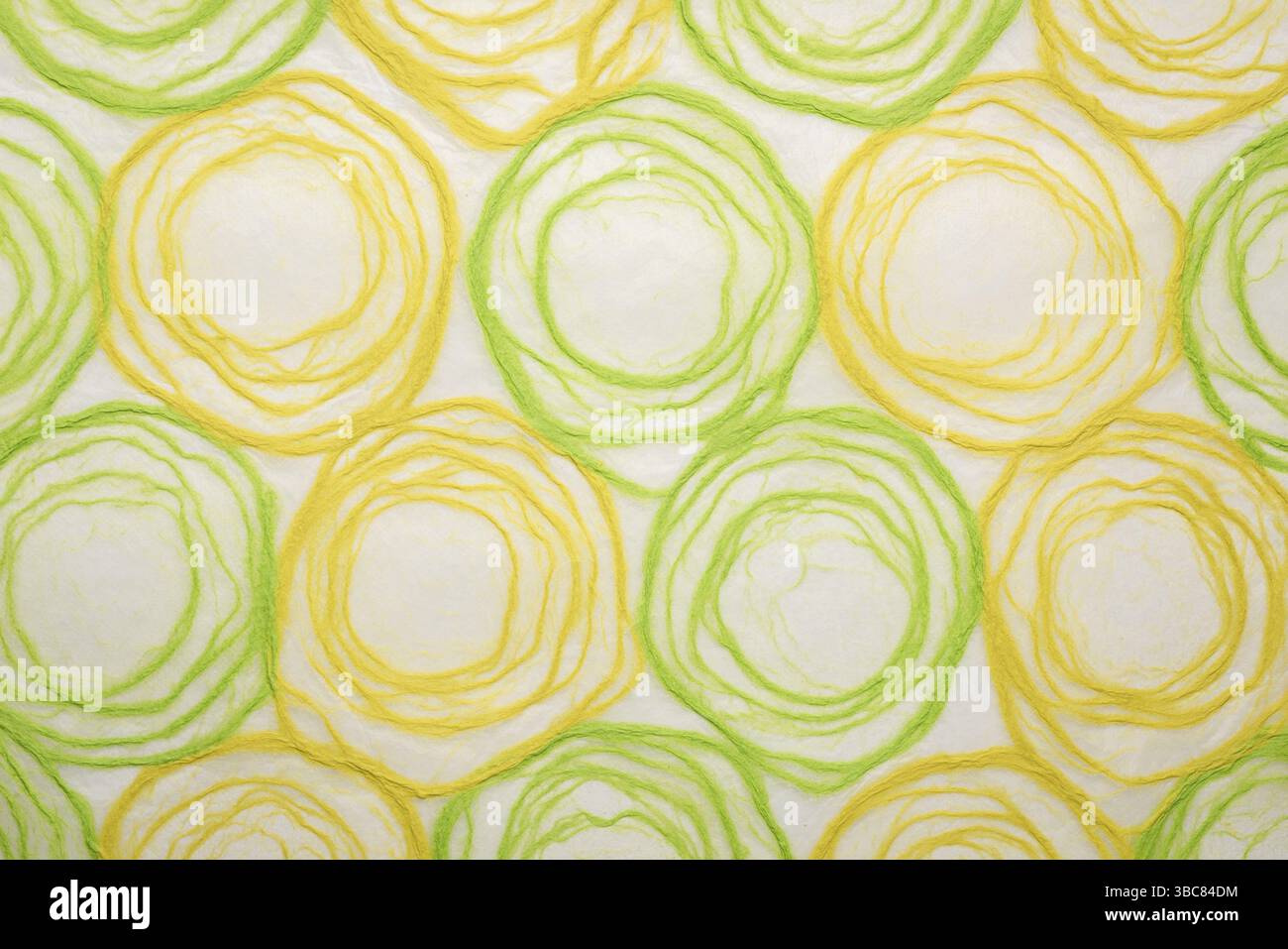 Thai mulberry ringlet paper with green and yellow funneling whirls of ...