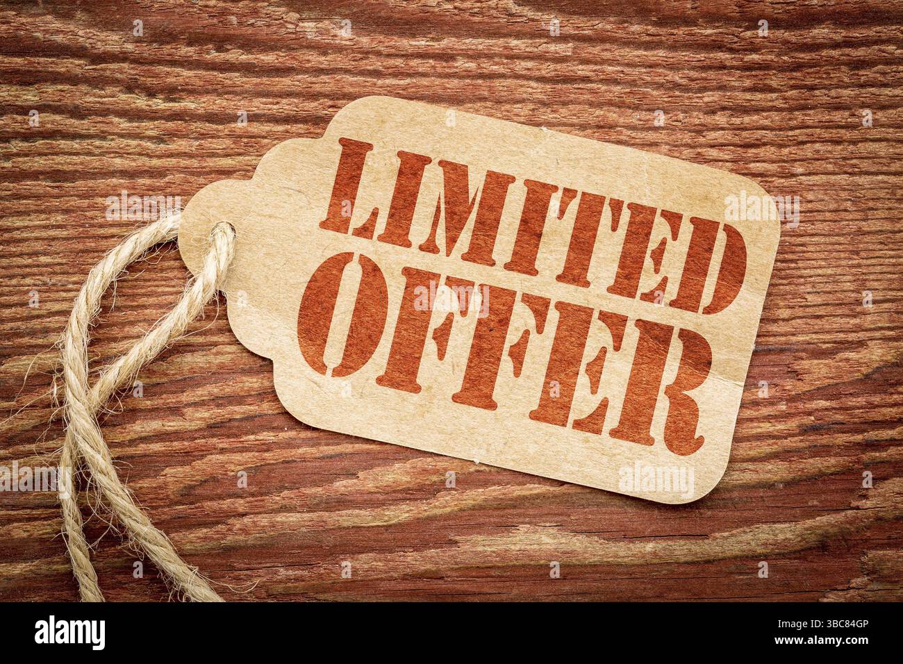 Limited offer sign - red stencil text on a cardboard price tag against ...