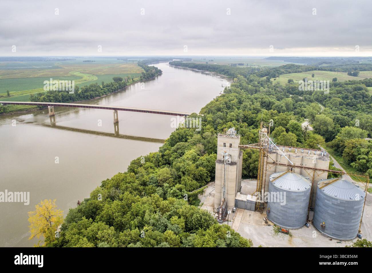 Missouri River at Miami, MO with a highway bridge and grain elevators ...