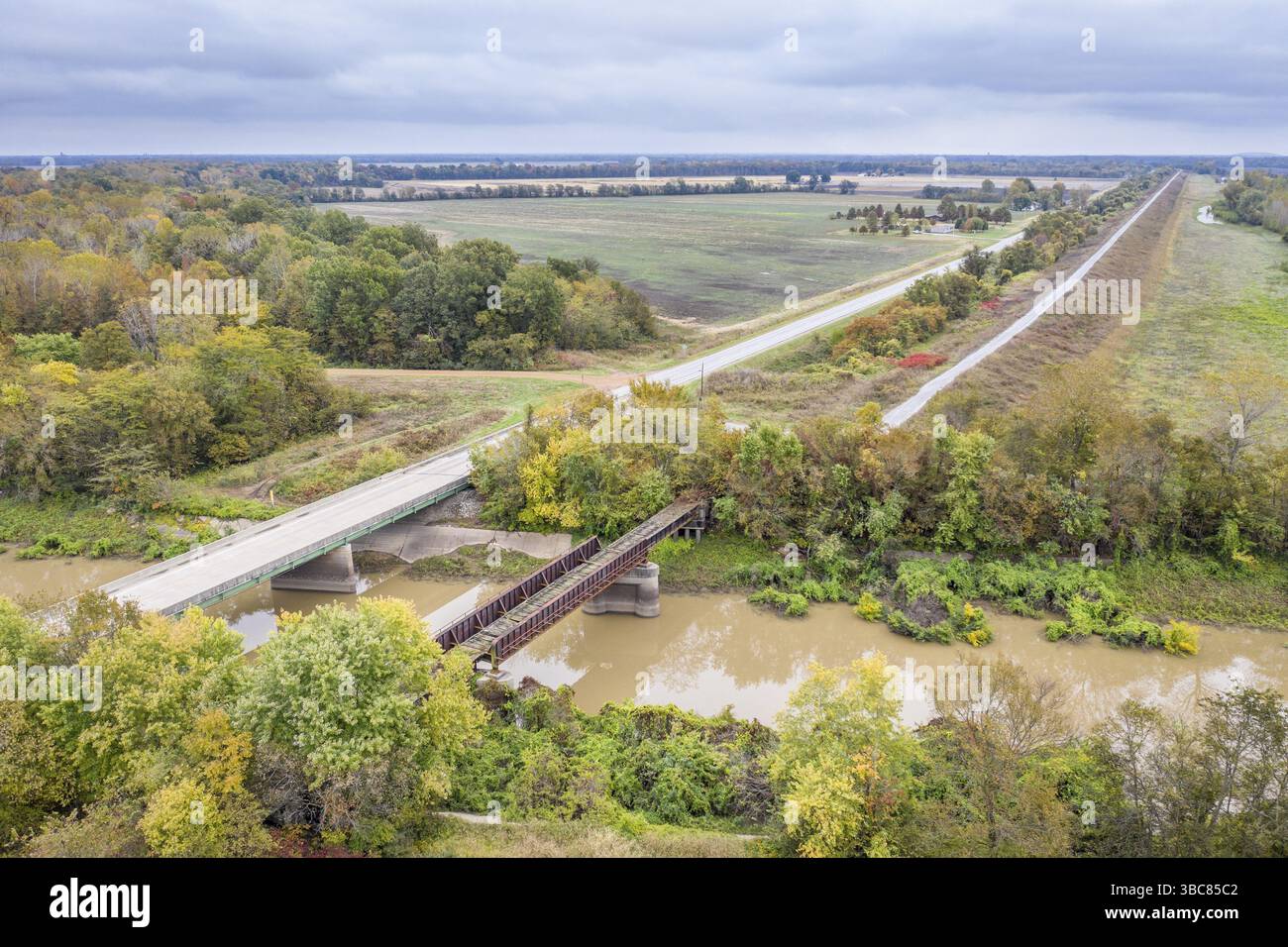 Highway bridge and trestle of abandoned railway across Cache River in ...