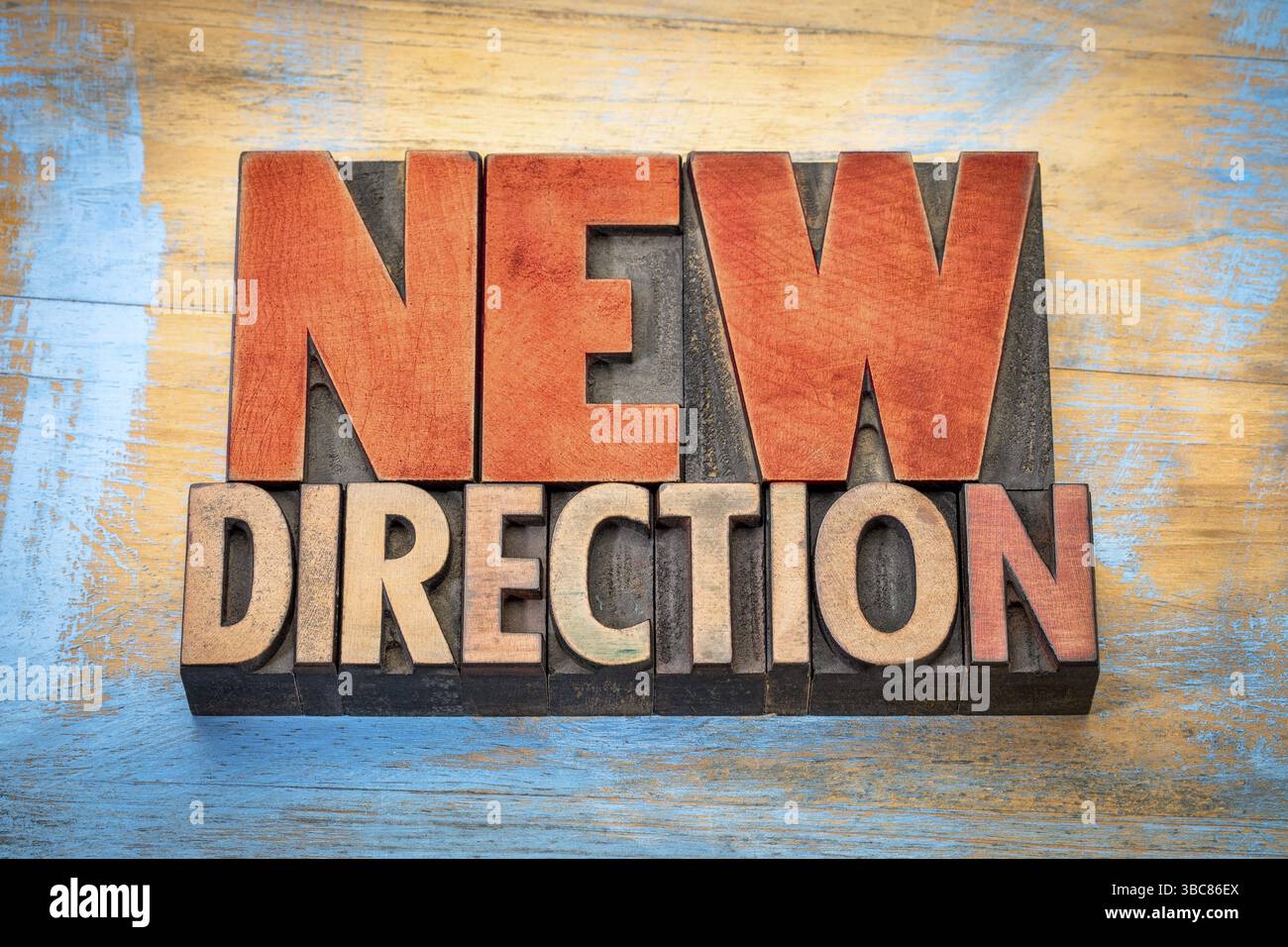 New direction word abstract in vintage letterpress wood type blocks ...