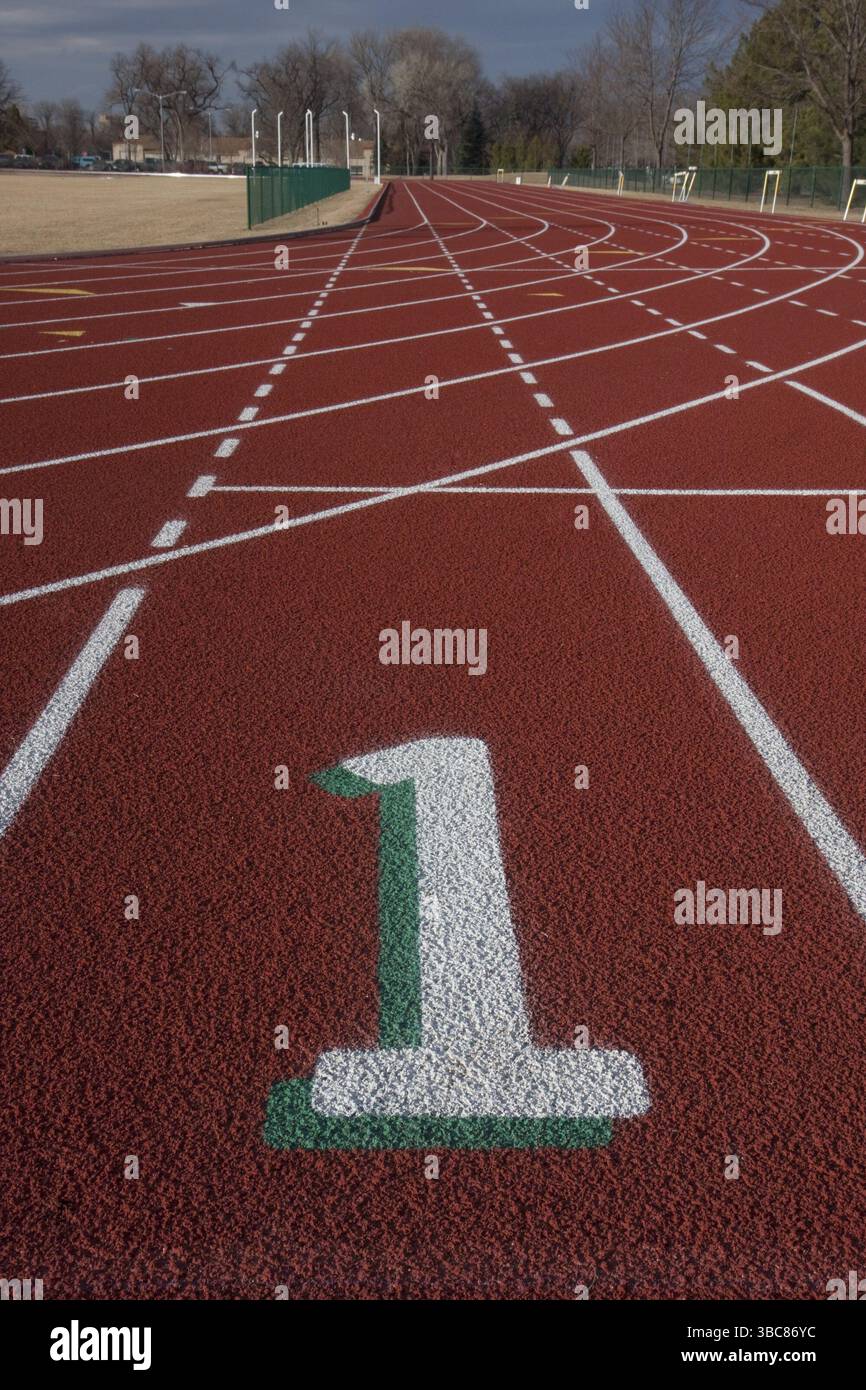 White lane number one at a starting line red running tracks Stock Photo ...