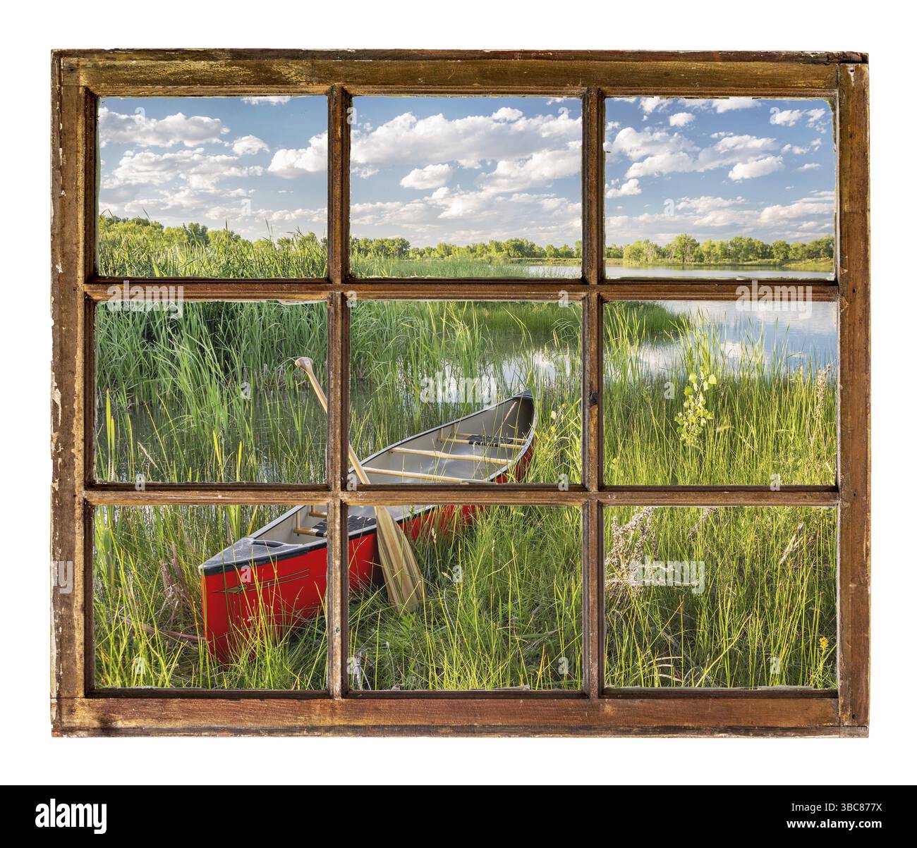 Red canoe on lake shore in summer scenery as seen through vintage ...