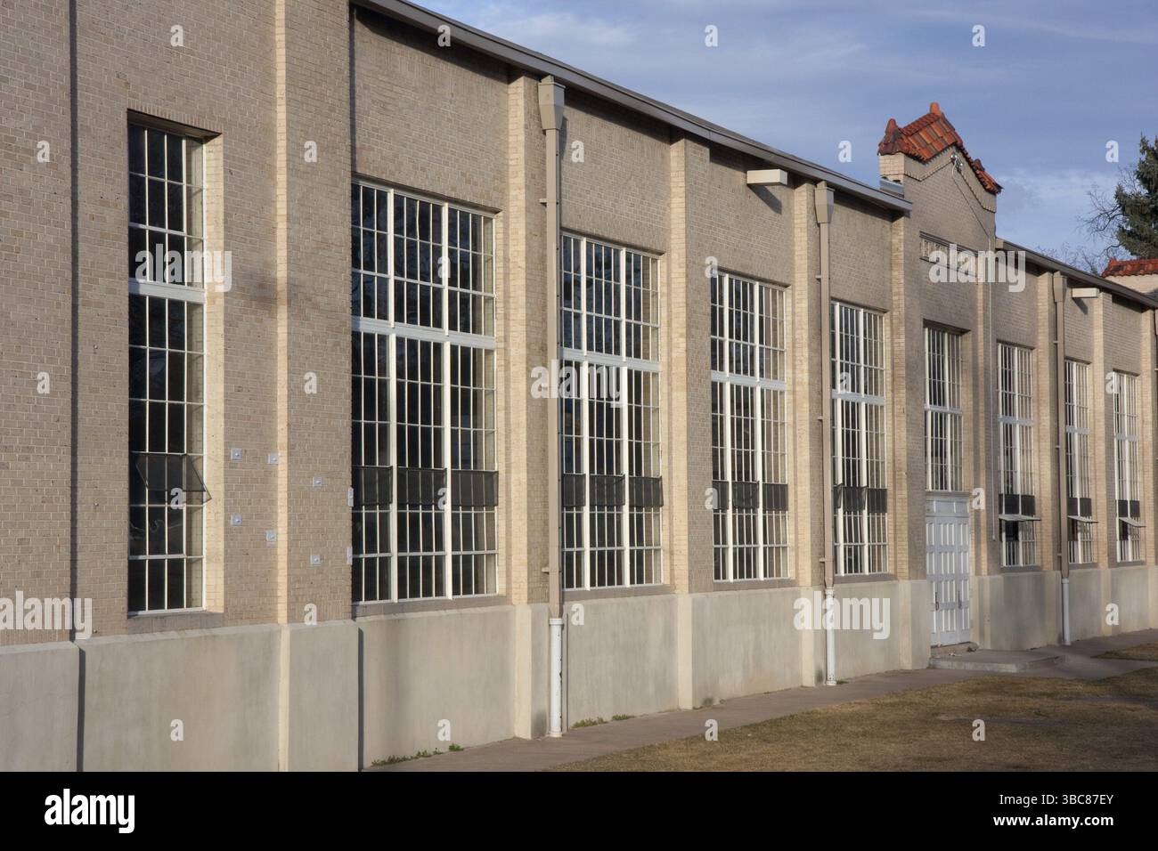 Wall with bug windows - exterior of old field house with indoor sport ...