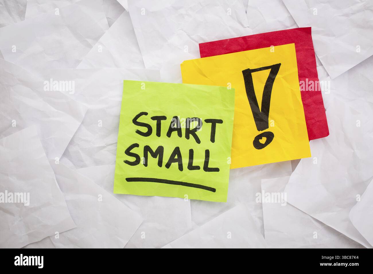 Start small - reminder or advice handwritten on colorful sticky notes ...