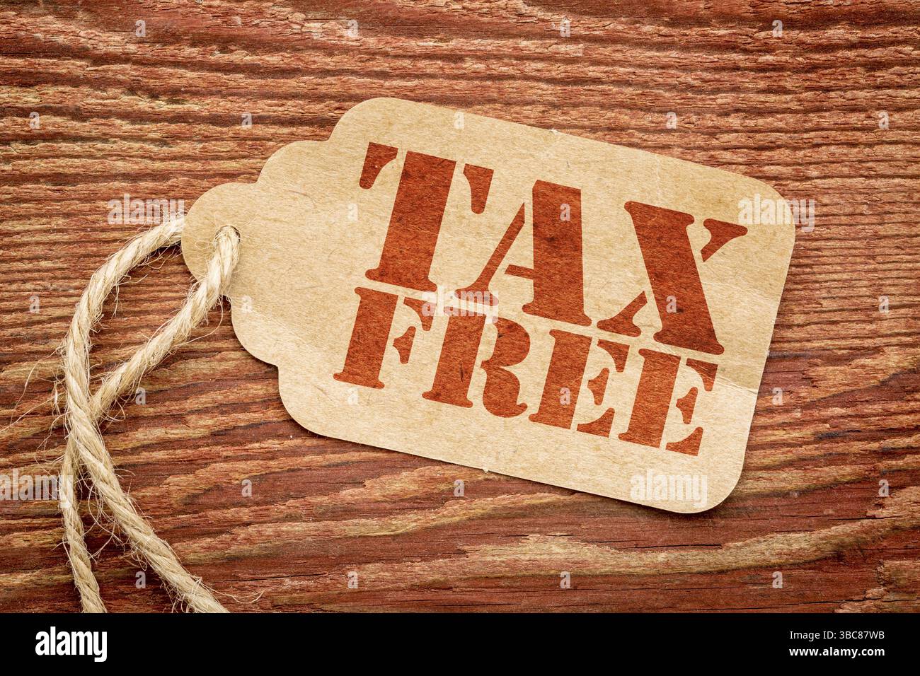 Tax free sign - stencil text on a price tag against rustic wood Stock ...