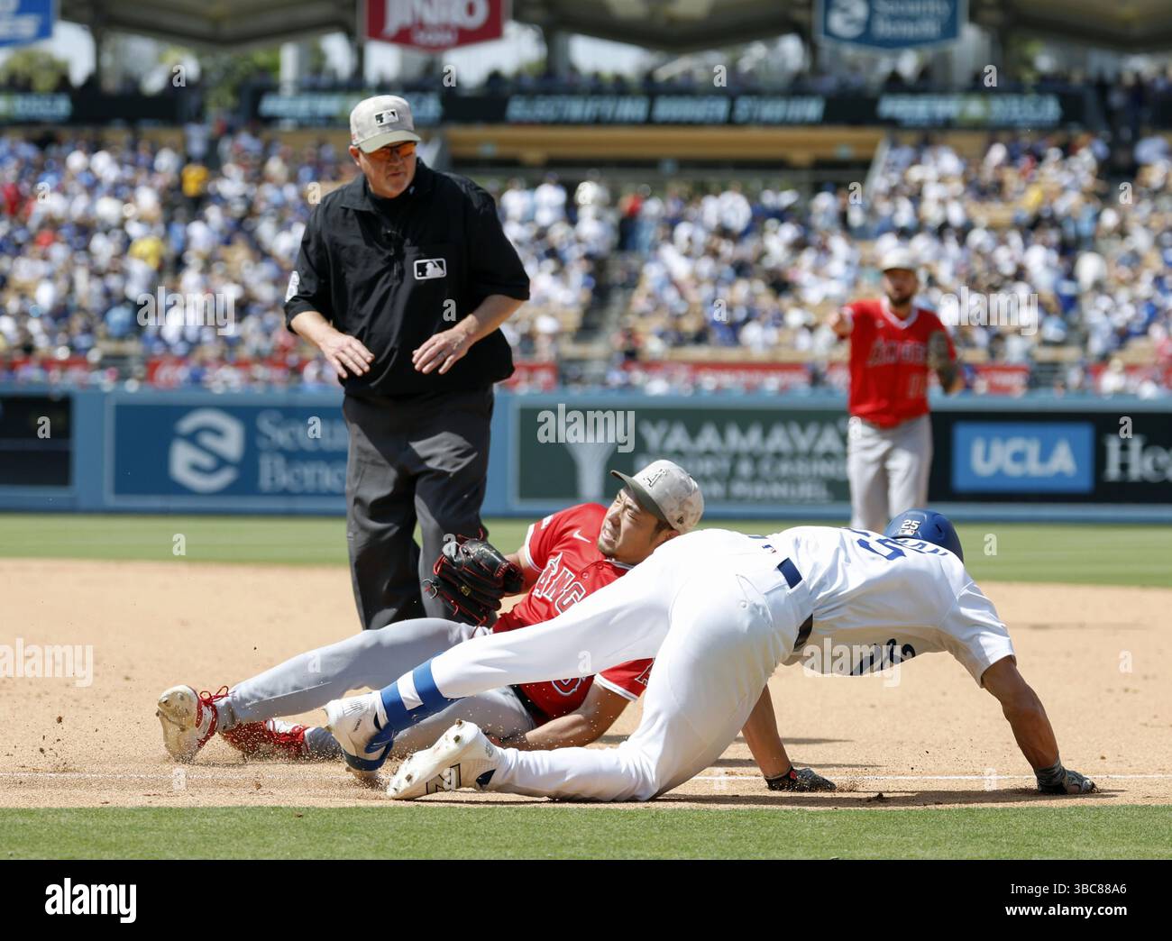 Los Angeles Angels pitcher Yusei Kikuchi (L) collides Tommy Edman of ...