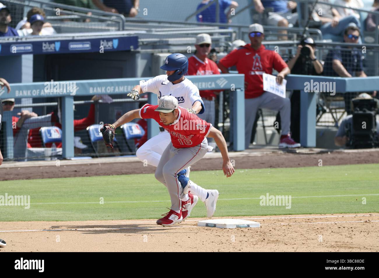 Los Angeles Angels pitcher Yusei Kikuchi (front) collides Tommy Edman of the Los Angeles Dodgers ...