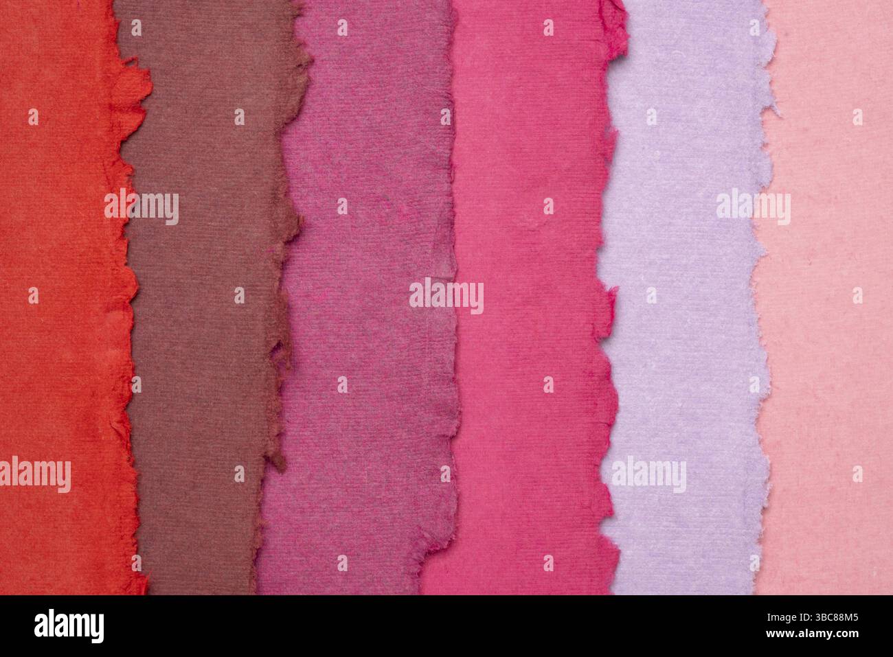 Collection of handmade Indian paper in pink and red tones produced from ...