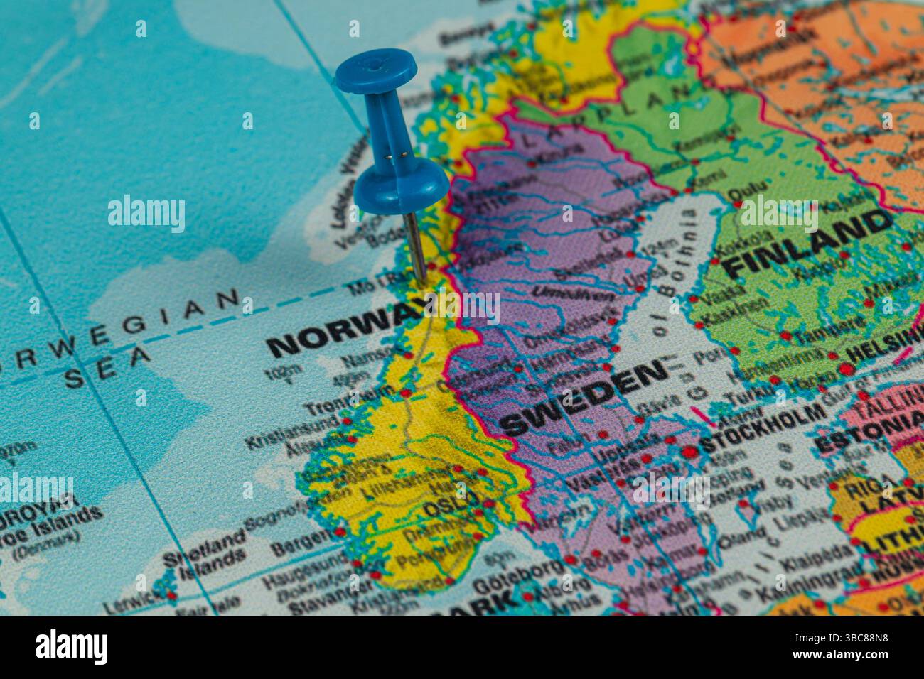 A detailed map displays Norway and Sweden, with vibrant landforms ...