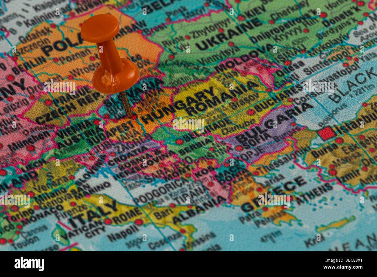 A bright orange pin marks Budapest on a detailed map of Europe ...