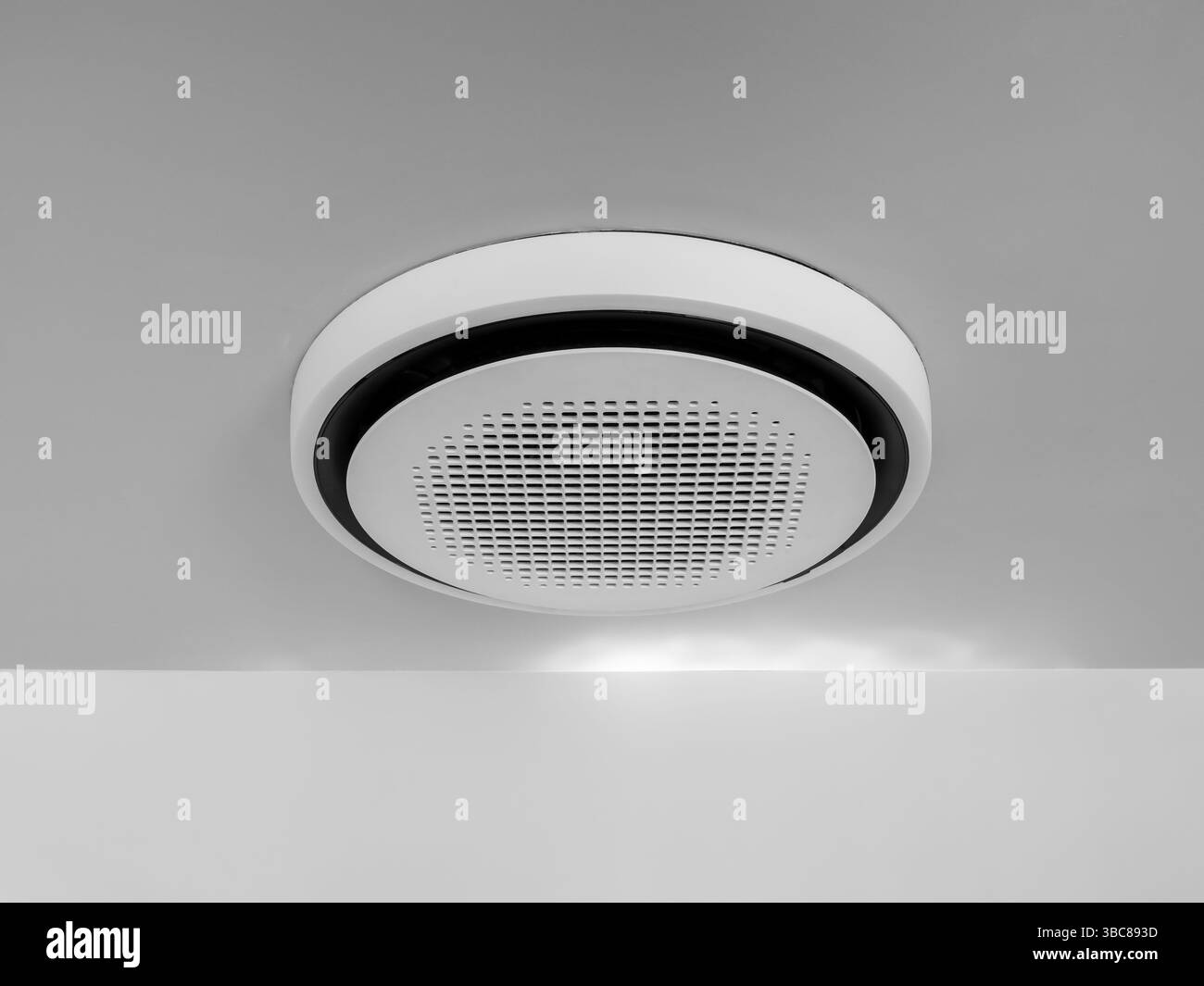 Cooler ceiling air conditioner concept. Modern white round cassette air ...