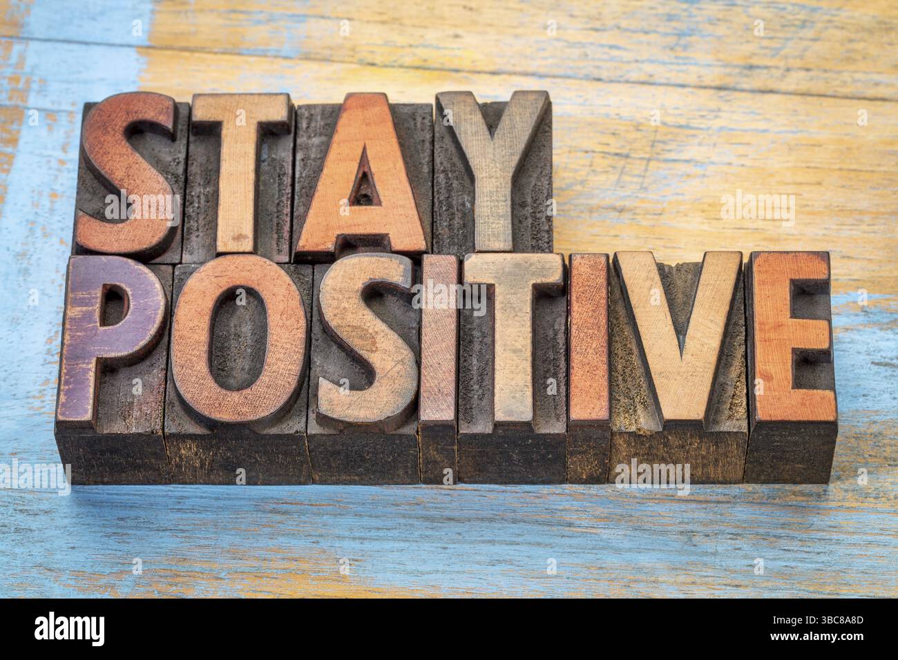 Stay positive - motivational word abstract in vintage letterpress ...