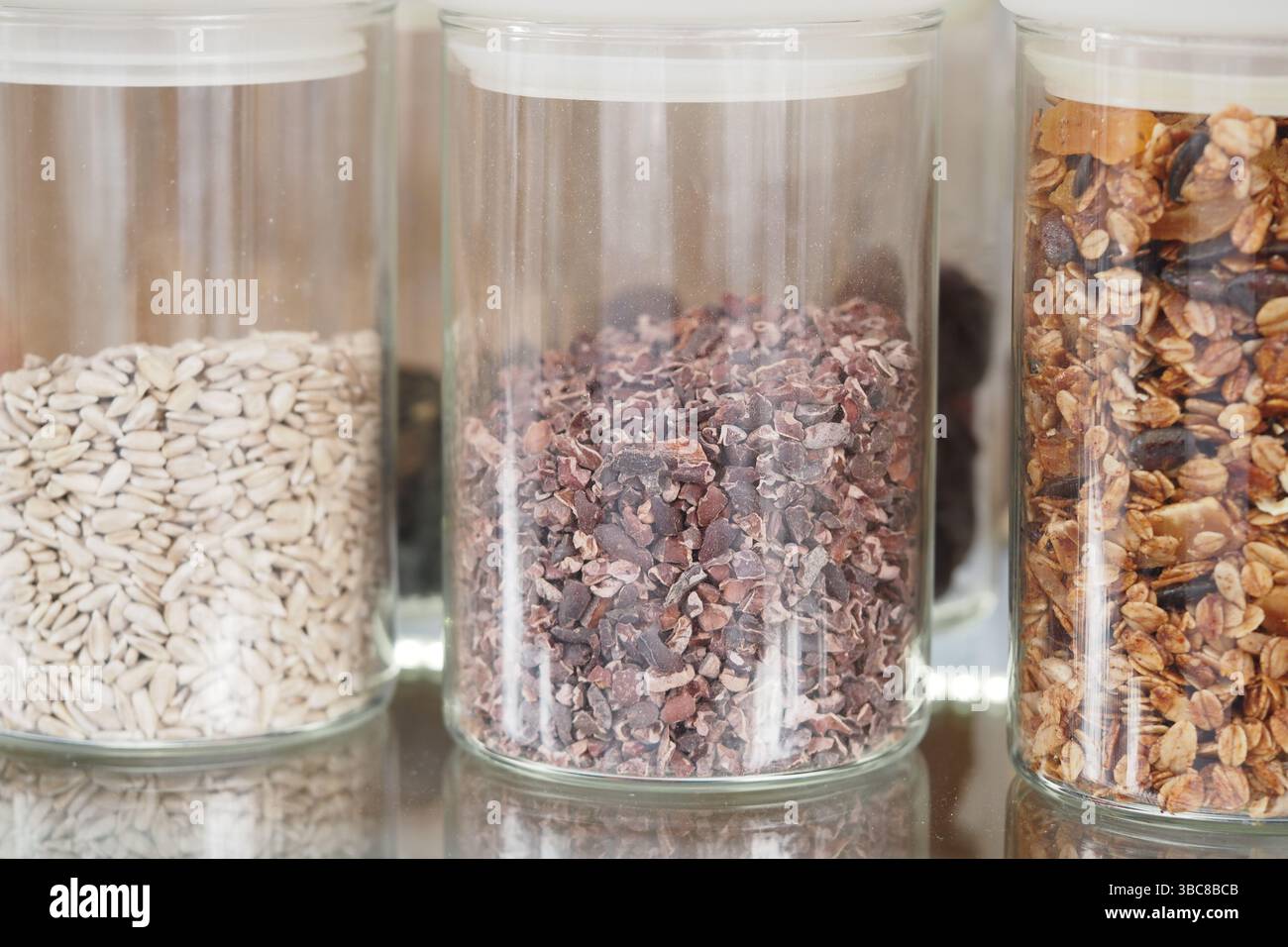 Containers holding various healthy ingredients on display Stock Photo ...