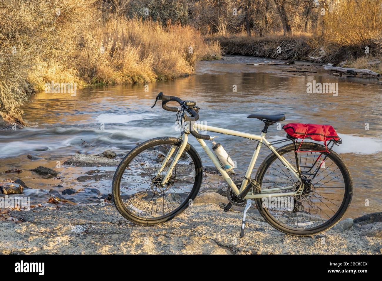 Touring bike and a river in fall scenery - Big Thompson River Trail in Loveland, northern ...