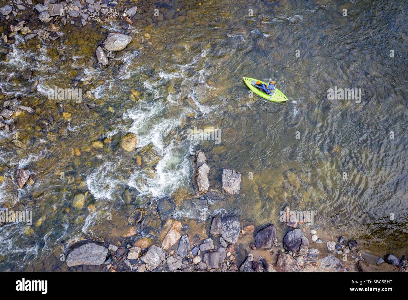 Inflatable whitewater kayak on a mountain river (Poudre River in ...
