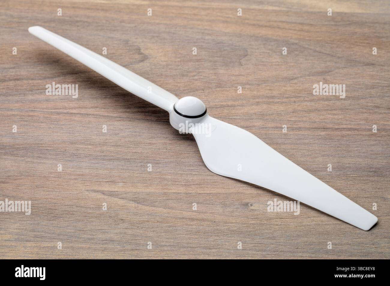 Plastic drone propeller against grained wood Stock Photo - Alamy