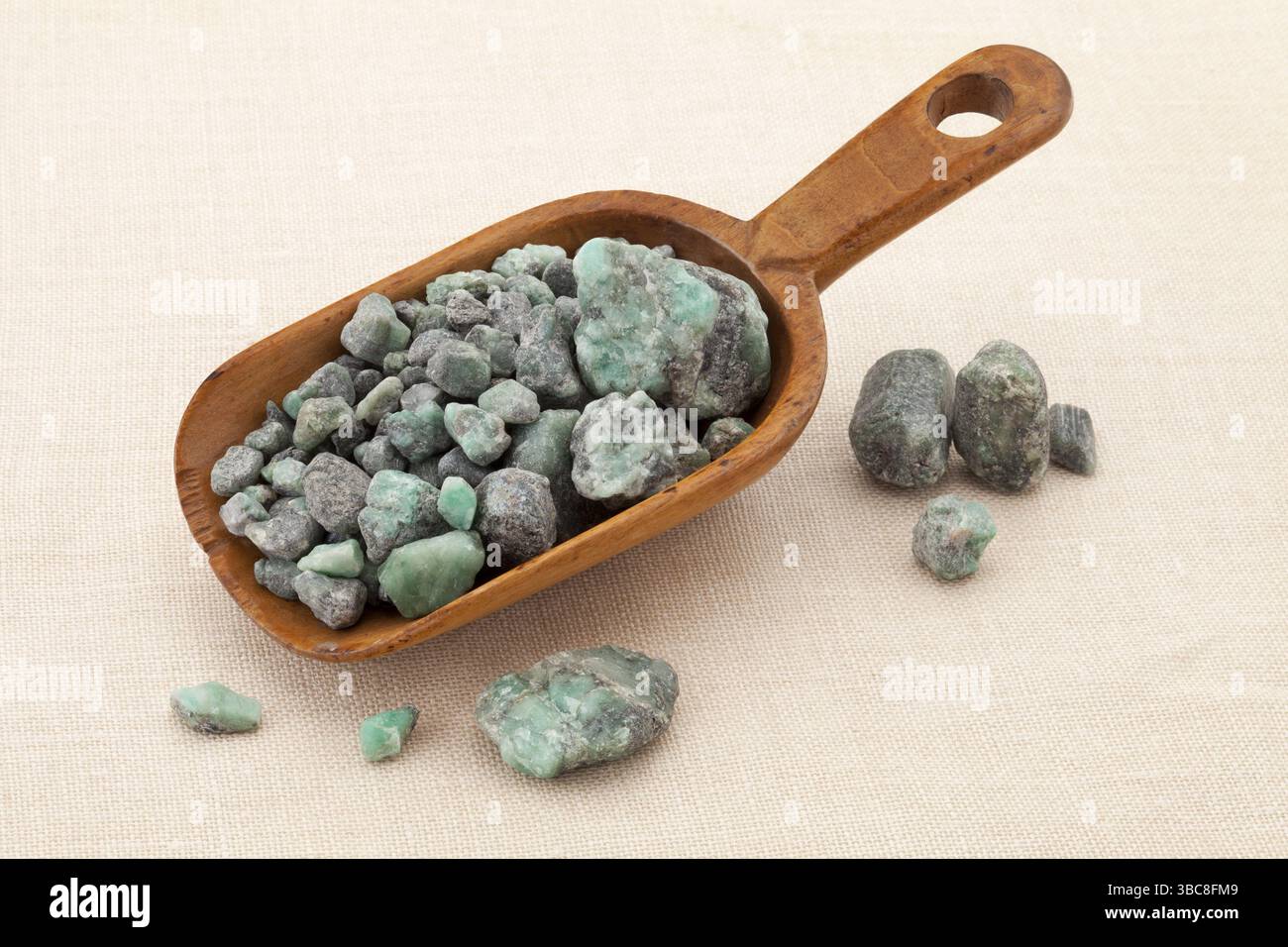 Rustic scoop of raw emerald gemstones (mineral beryl) with inclusions mined in Brazil Stock ...