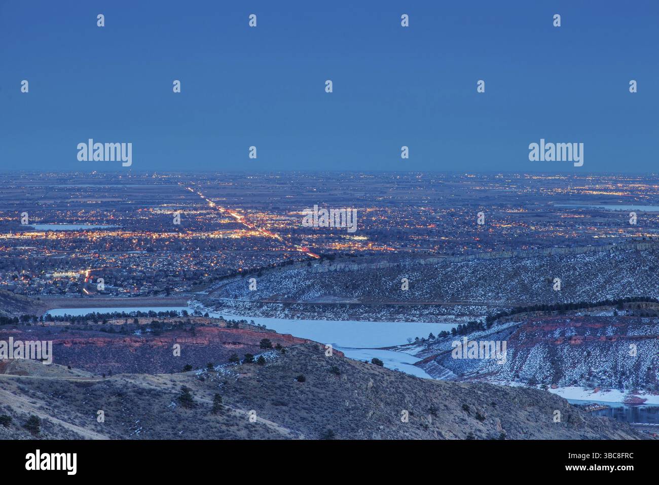 Night view of Fort Collins in Colorado with foothills and Horsetooth ...