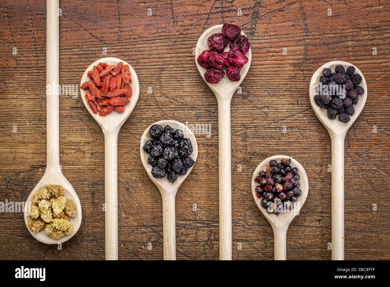 Healthy dried berry collection (blueberry, mulberry, cherry, goji ...