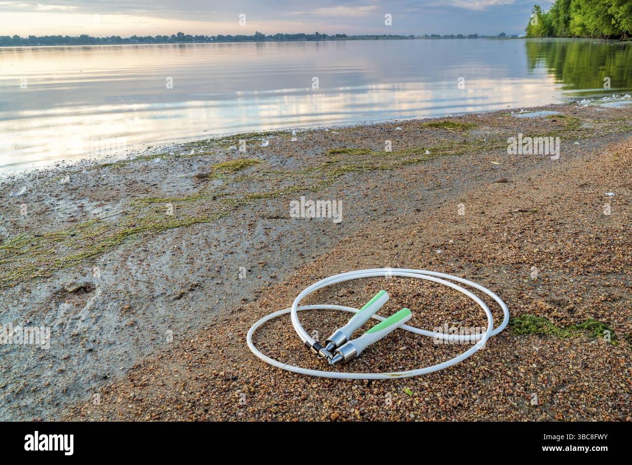 Heavy fitness jump rope on a lake beach, Boyd Lake State Park in ...