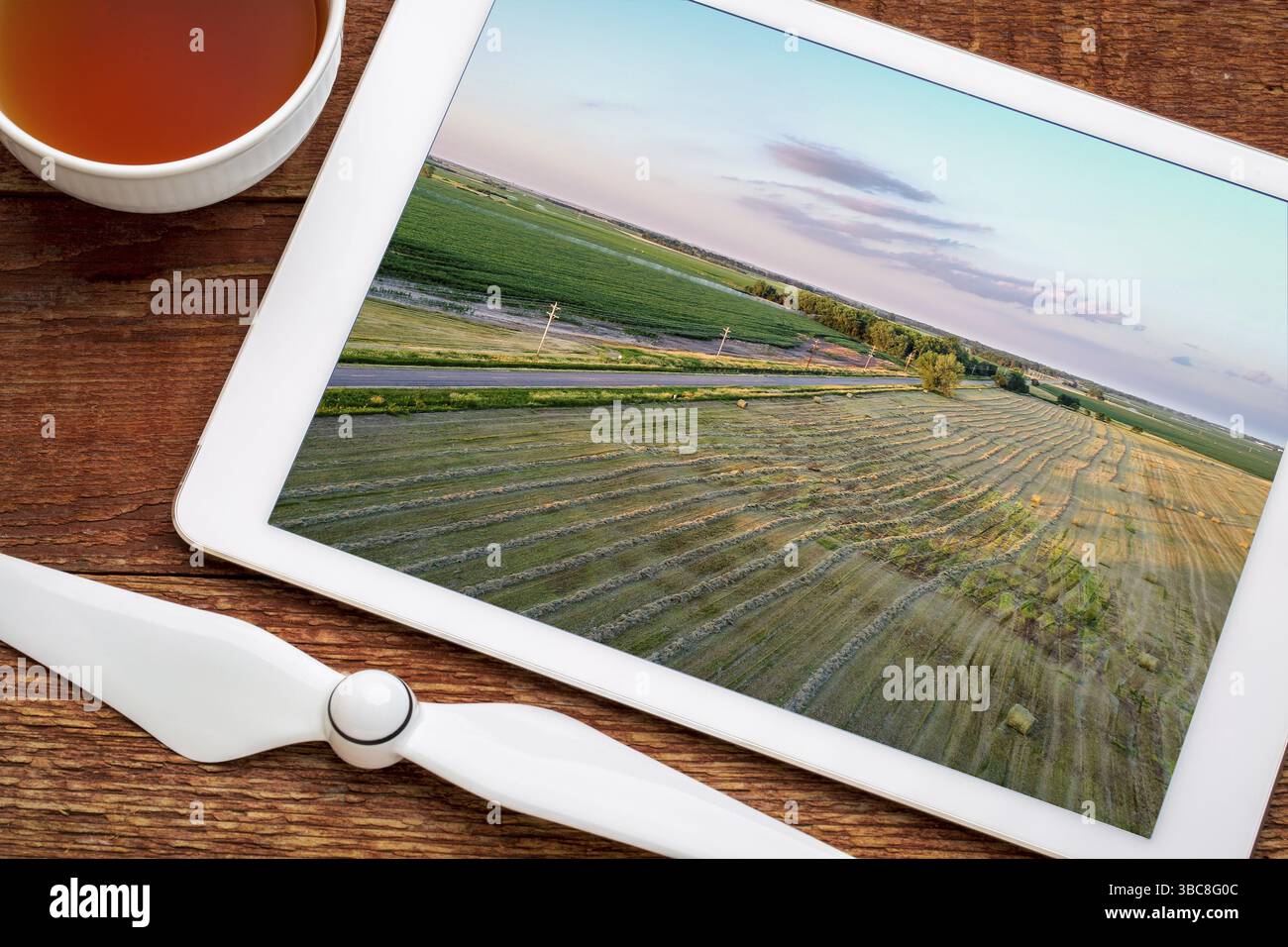 Aerial view of rural Nebraska landscape with a narrow road, meadow and ...