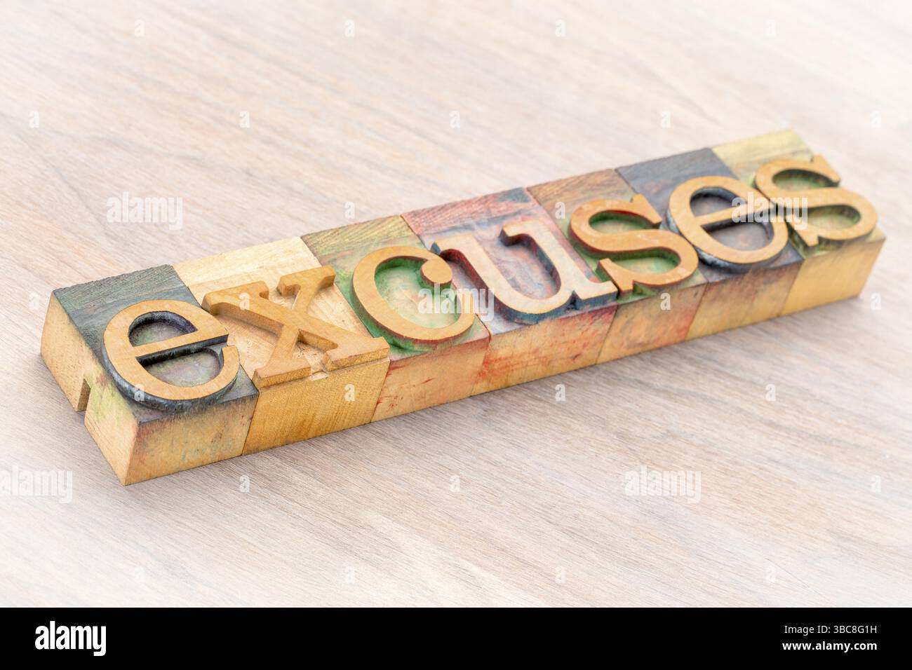 Excuses word abstract in letterprtess wood type blocks stained by color ...