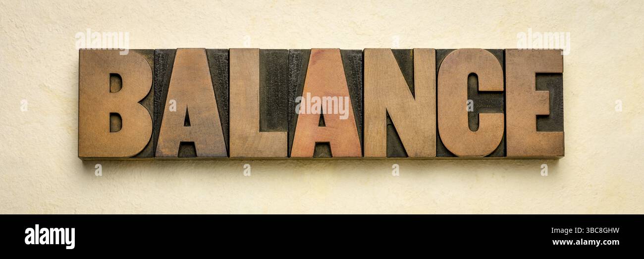 Balance word in vintage wood type against handmade bark paper, harmony ...