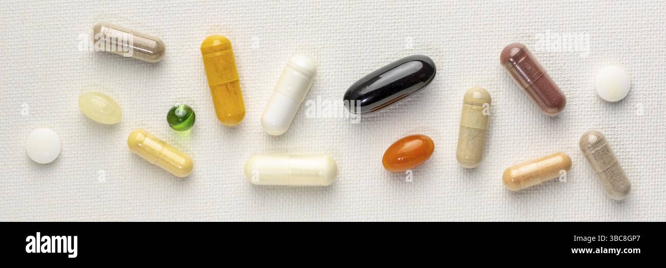 Vitamins and supplements background - pills, capsules and tablets on a ...