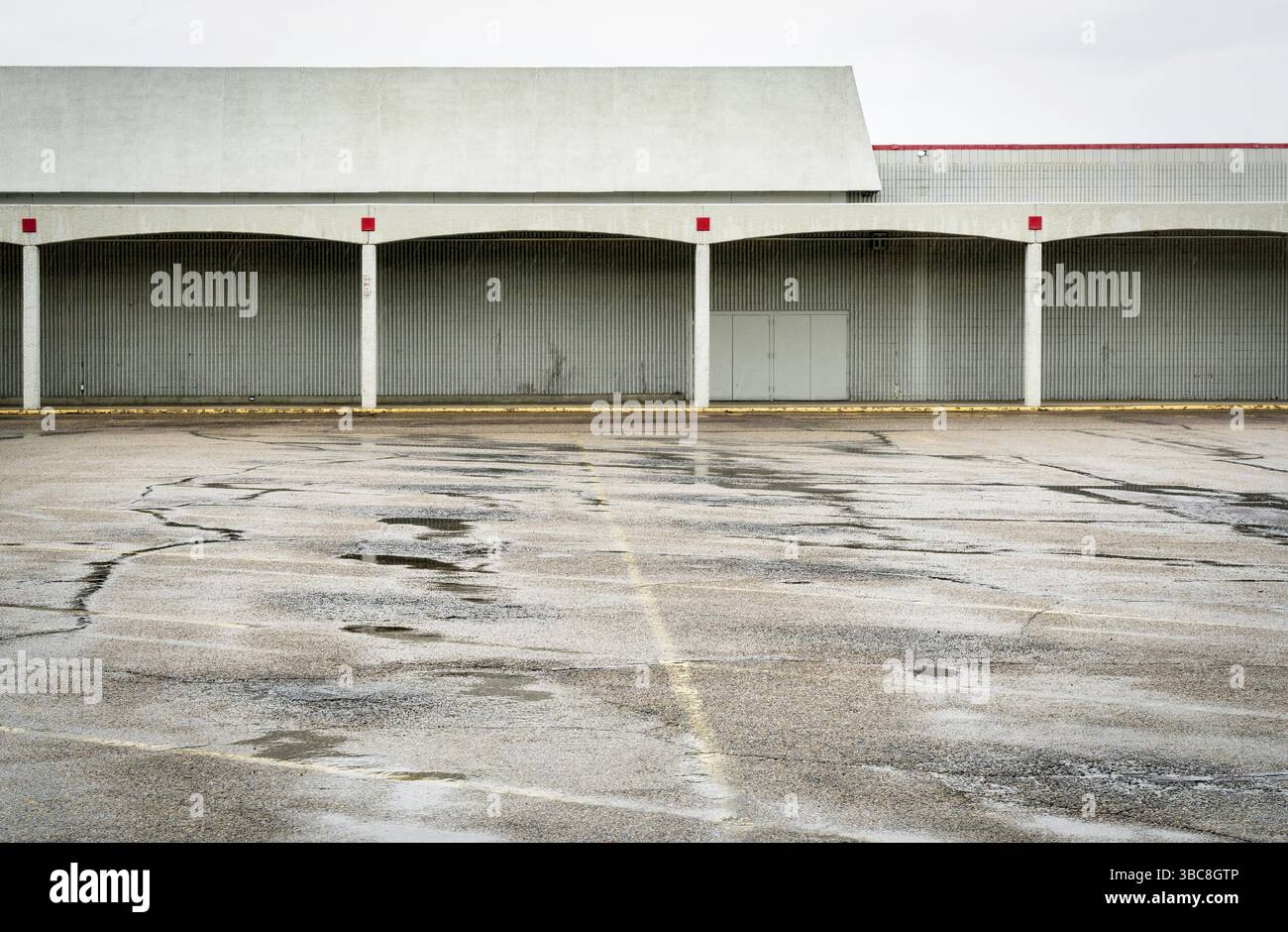 Rain over empty parking lot of a shut down shopping mall Stock Photo ...