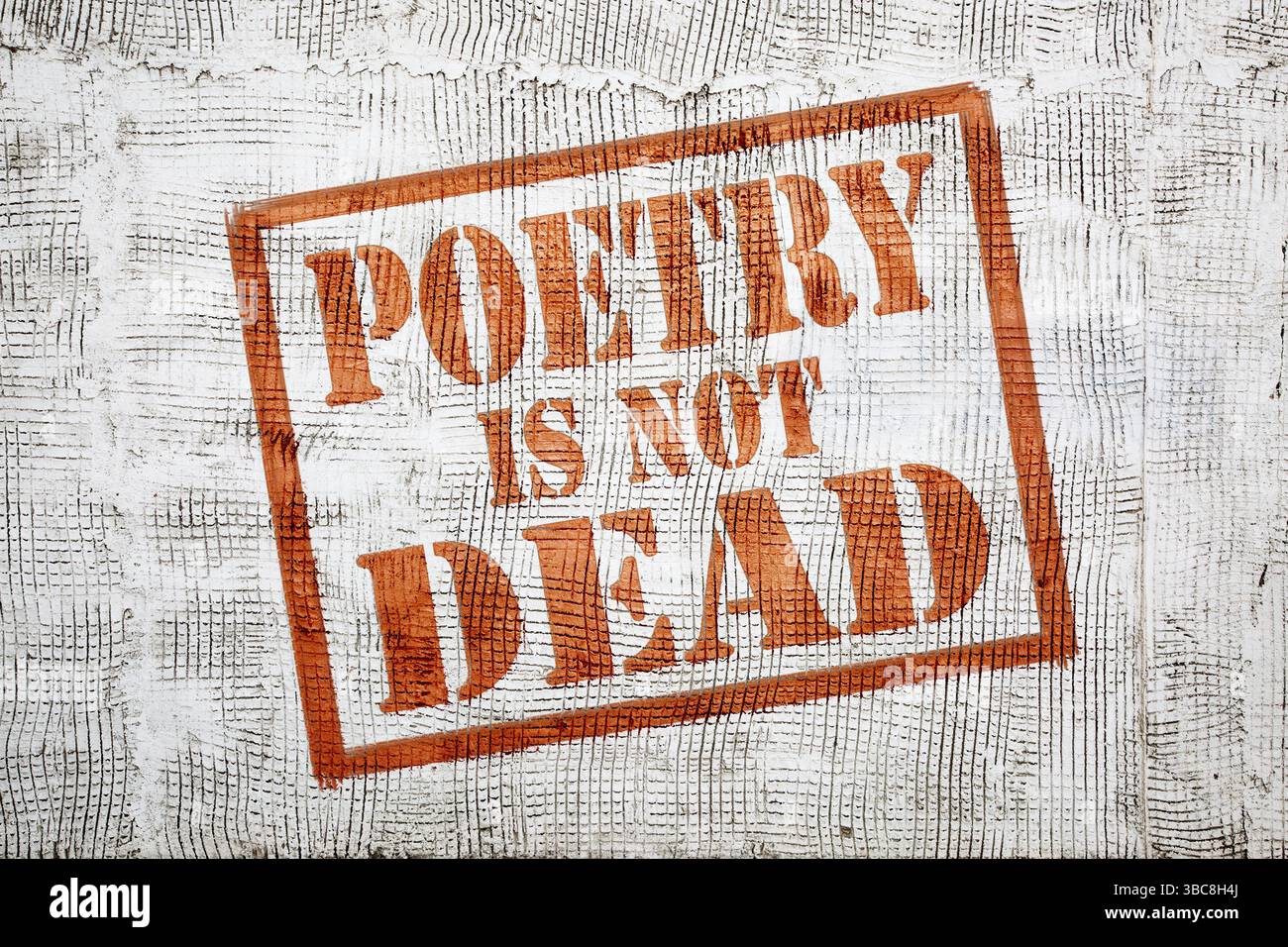 Poetry is not dead - graffiti sign with arrow on stucco wall Stock ...