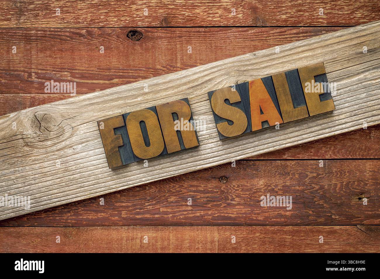 For sale sign - text in letterpress wood type over a grained cedar ...