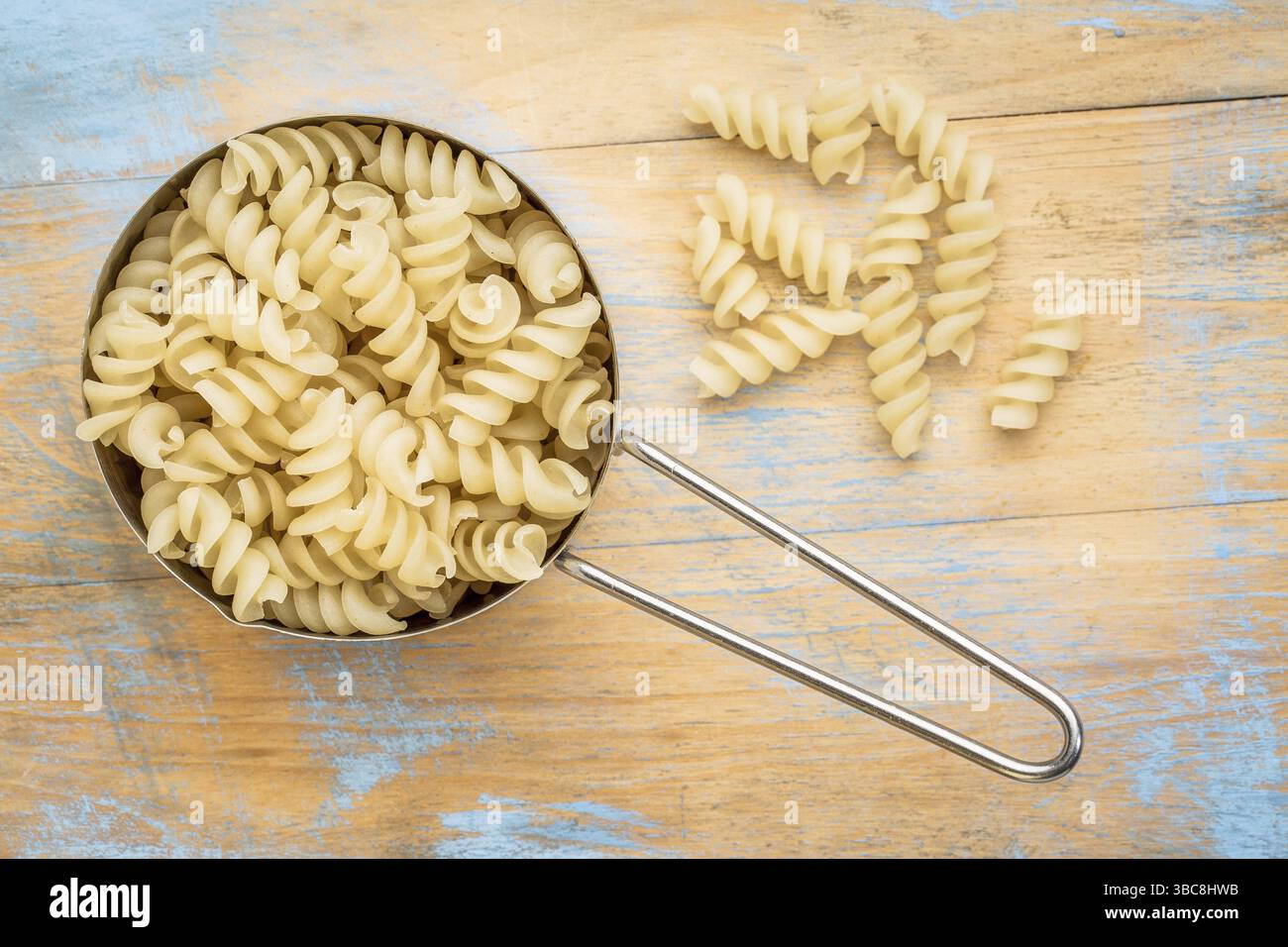 Healthy, gluten free quinoa pasta (fusilli) - top view of a metal ...