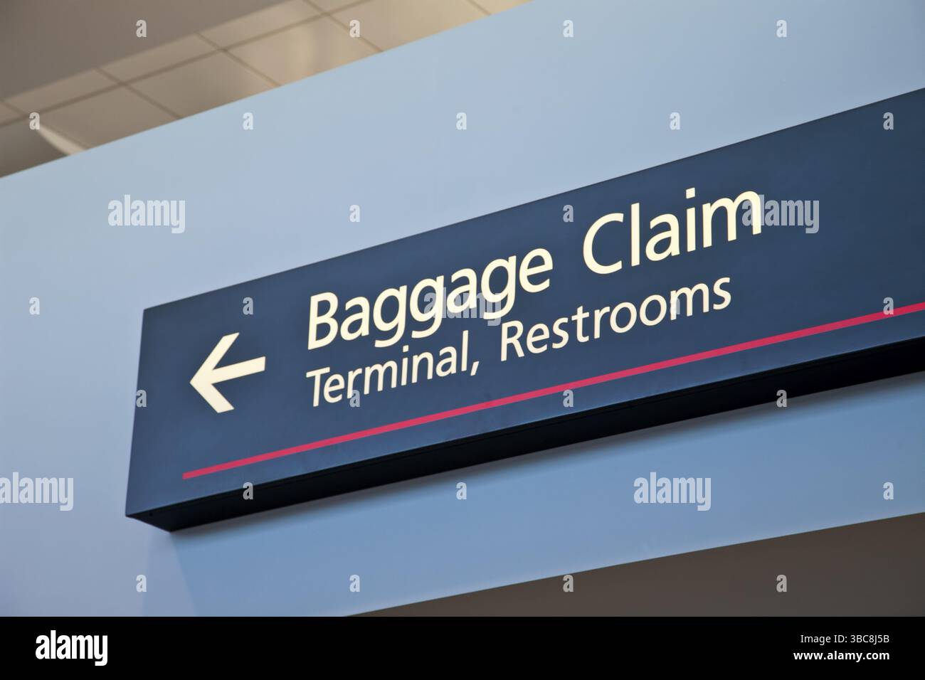Baggage claim, terminal, restrooms - airport sign with arrow Stock ...