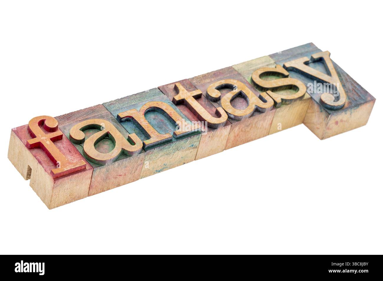 Fantasy word - isolated text in letterpress wood type blocks stained by ...