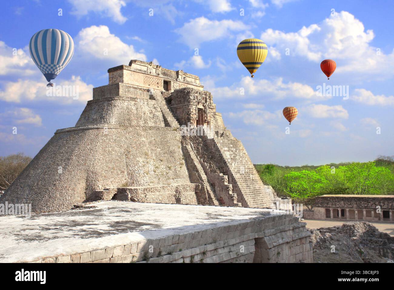 Air balloons and ancient Mayan pyramid of the Magician in Uxmal, royal ...