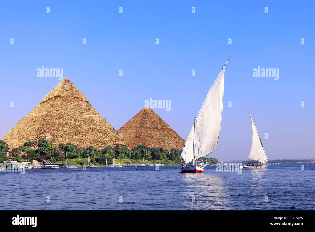 Great Pyramids of Chephren and Cheops and traditional sailing boat ...