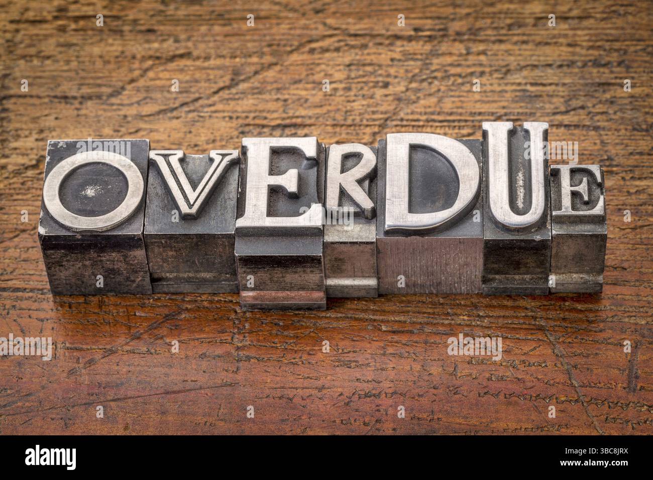Overdue word in mixed vintage metal type printing blocks over grunge ...