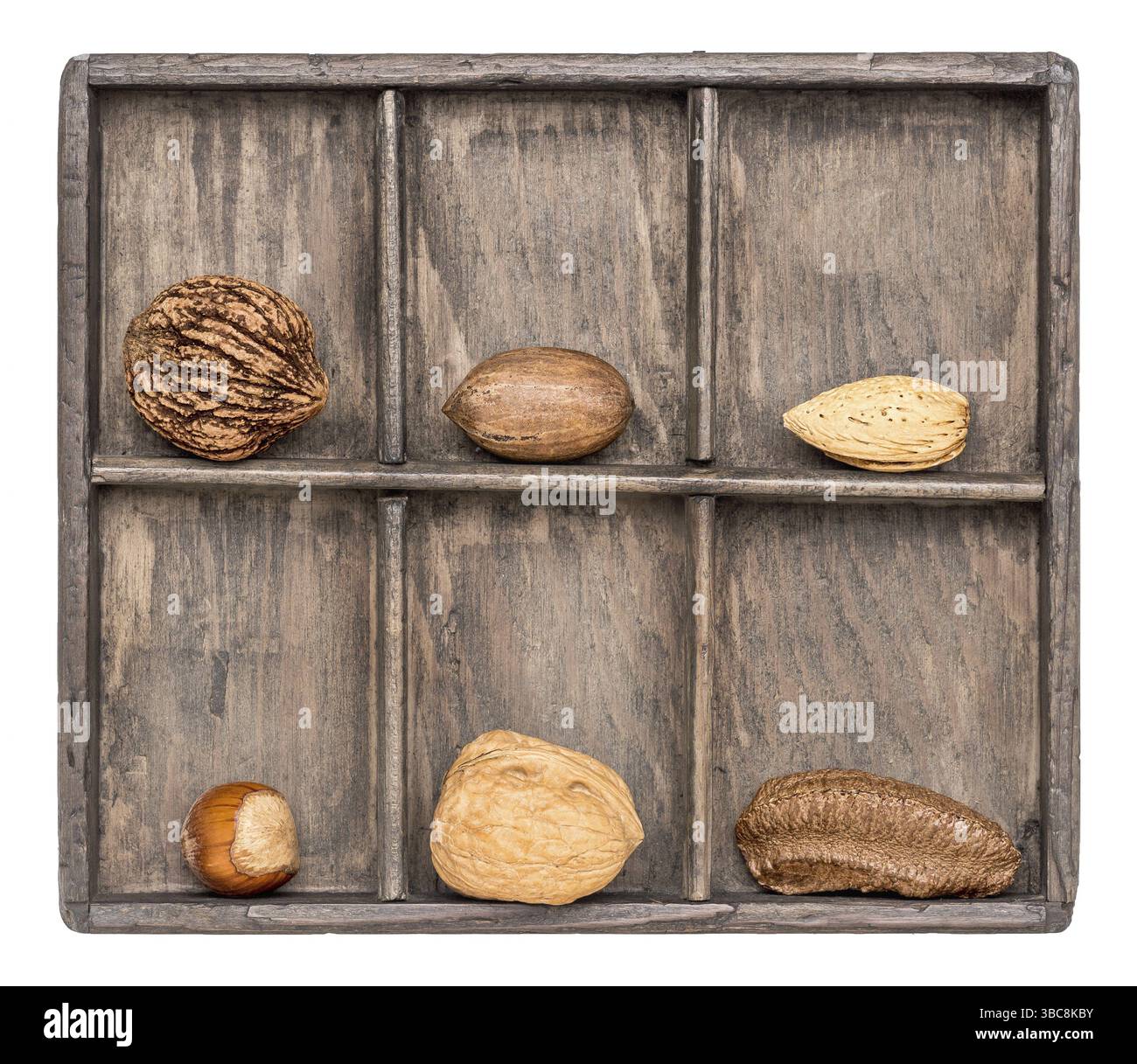 A variety of nuts (walnut, pecan, hazelnut, Brazilian and almond) in a ...