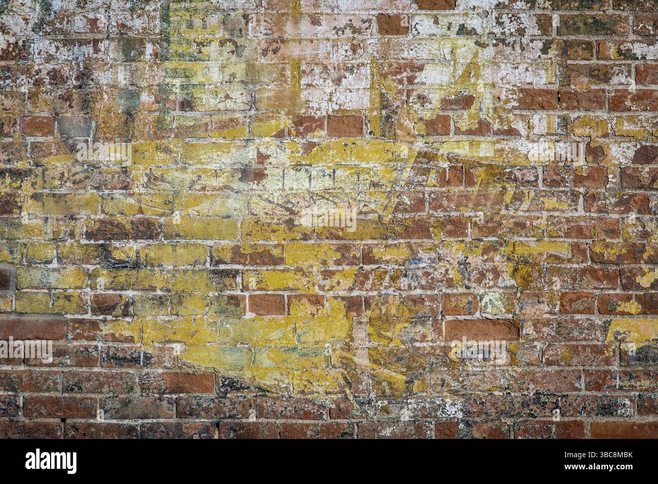 Background texture of a grunge brick wall with graffiti remains Stock ...