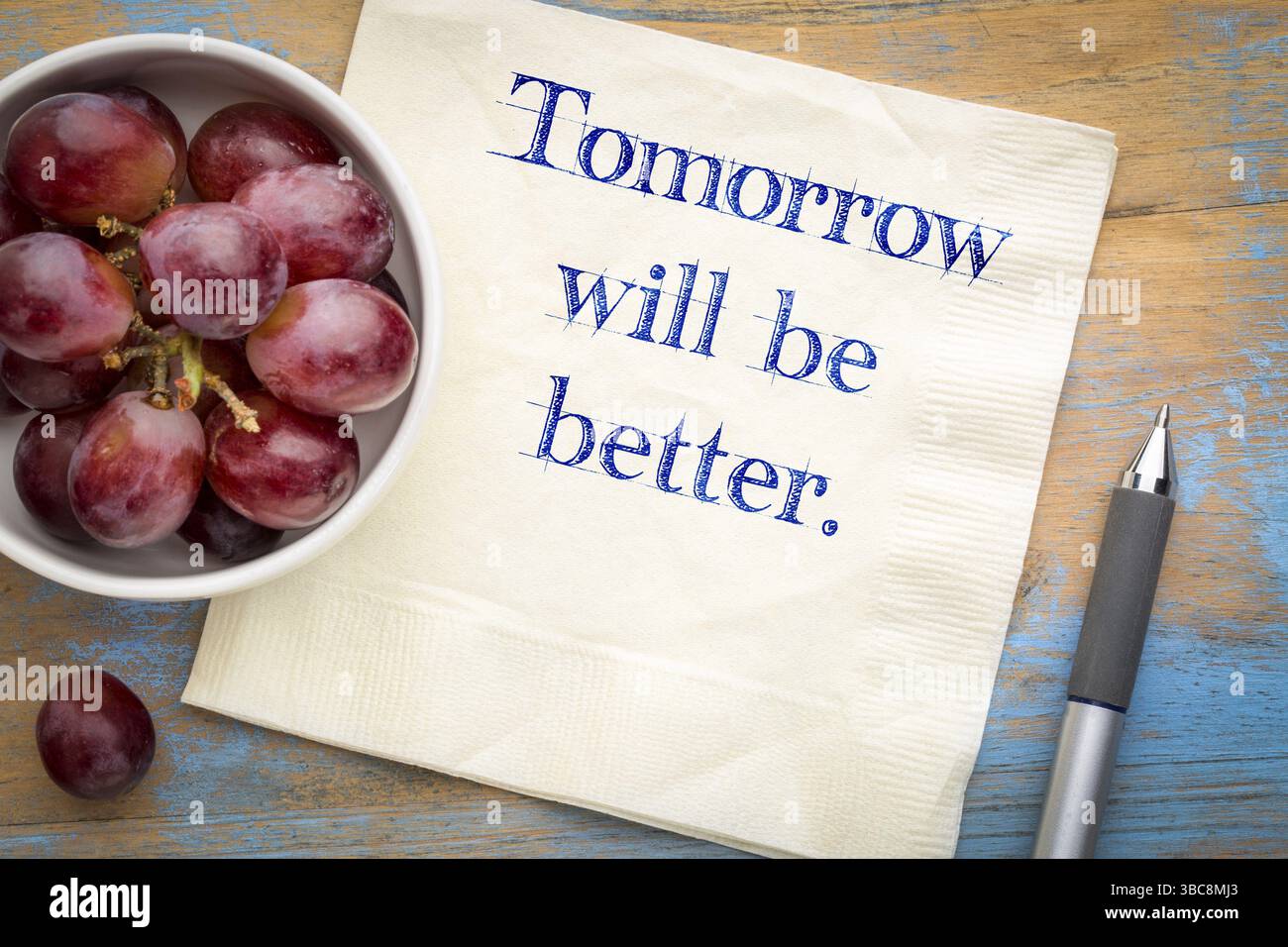 Tomorrow will be better. Handwriting on a napkin with a cup of tea ...