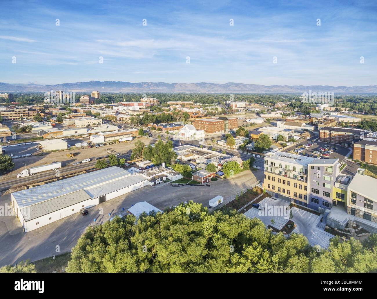 Aerial view of Fort Collins downtown with Front Range of Rocky ...