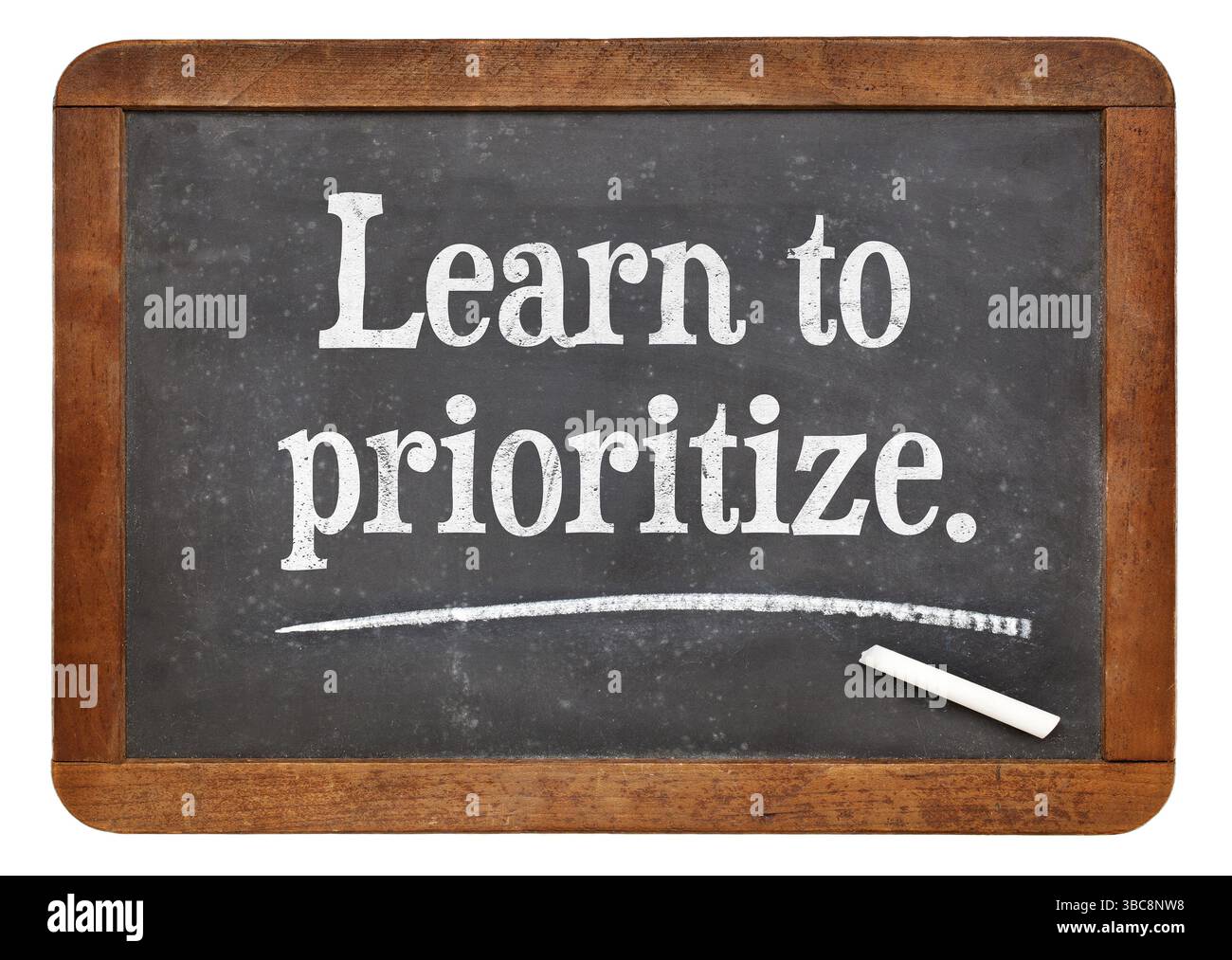 Learn to prioritize - motivational advice on a vintage slate blackboard ...