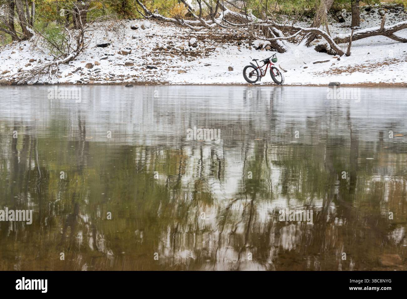 Mountain fat bike on a lake shore in fall scenery with snow, Horsetooth ...