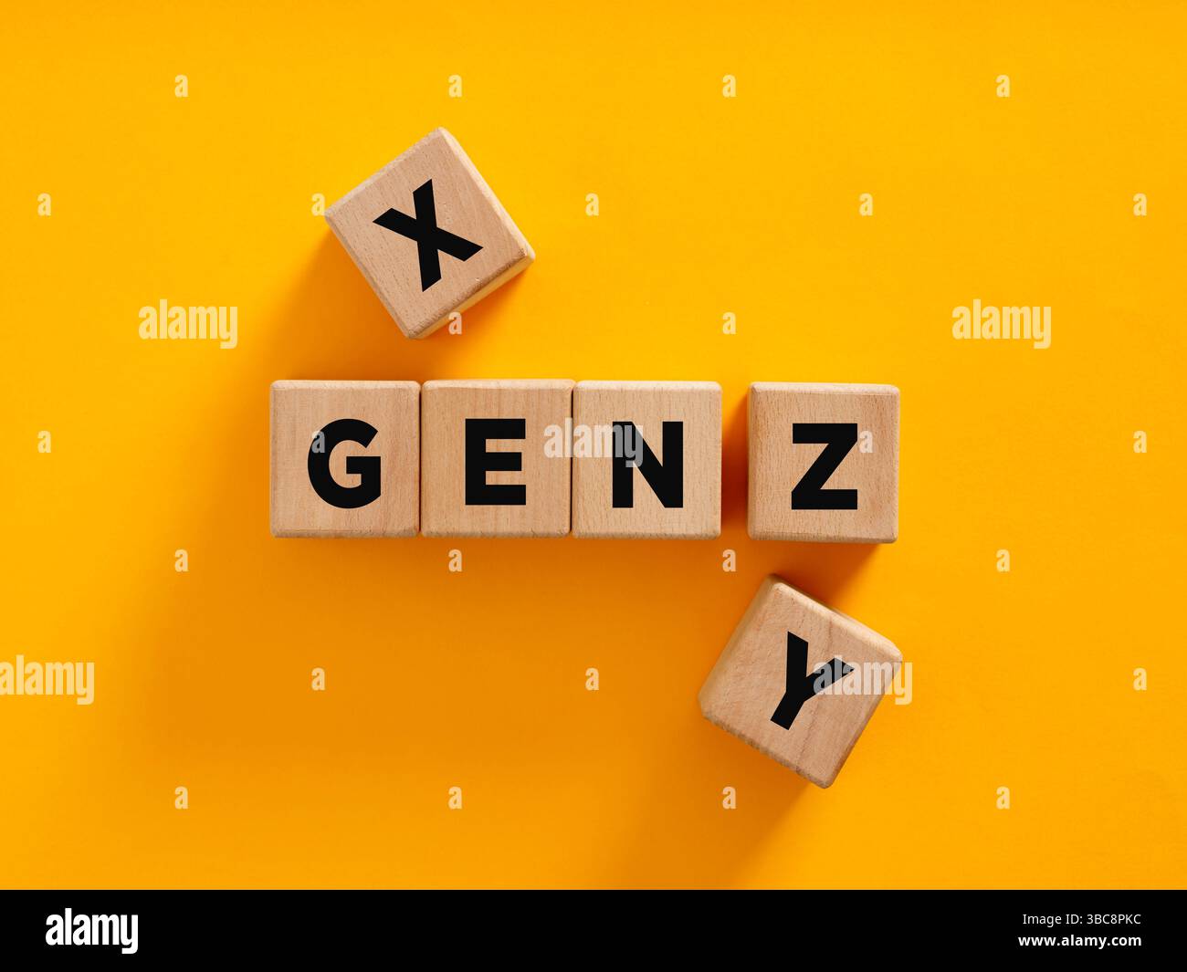 Wooden cubes composing the acronym gen z with other two cubes ...